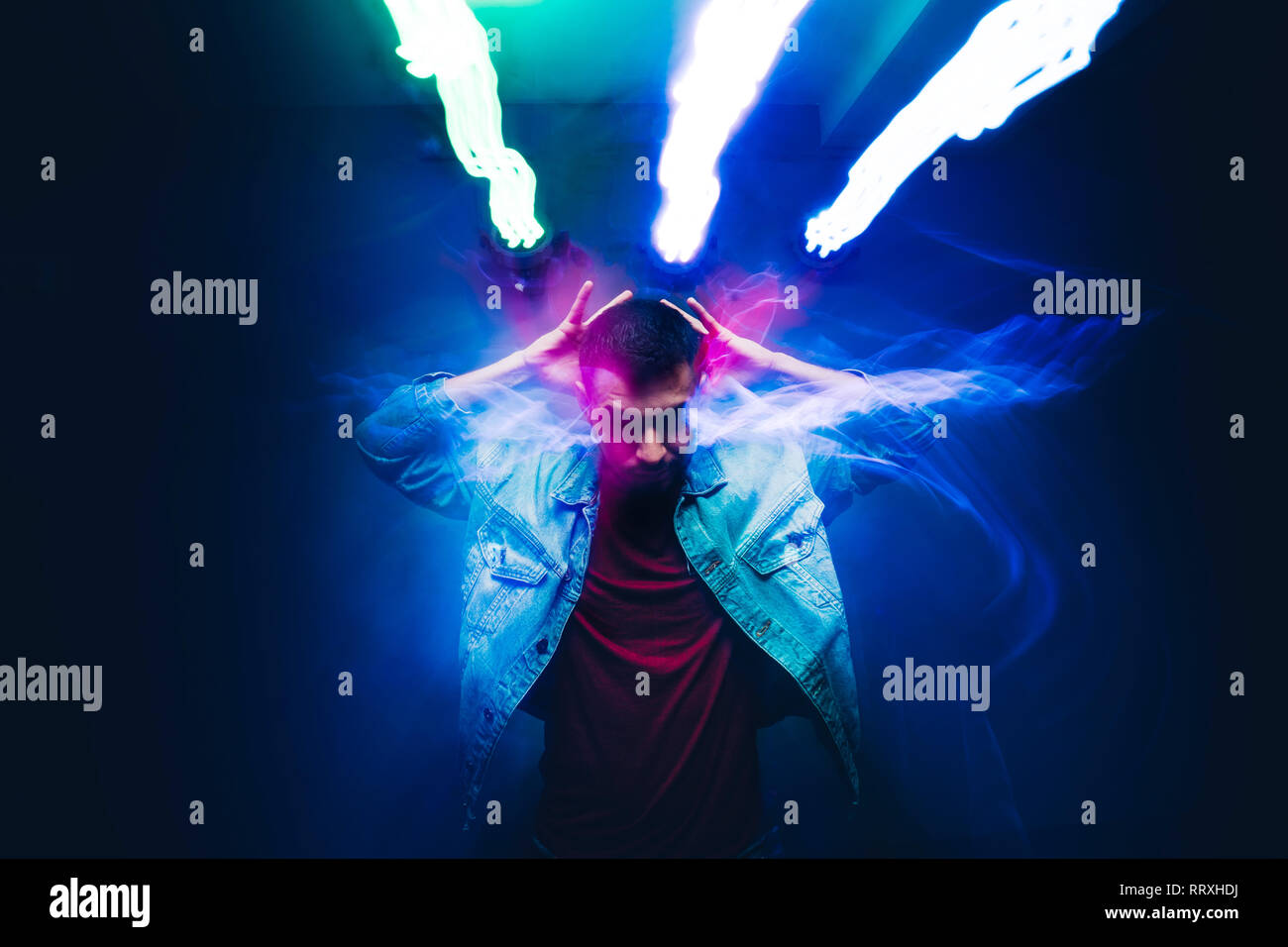 Handsome bearded man dancing in spotlight Stock Photo - Alamy