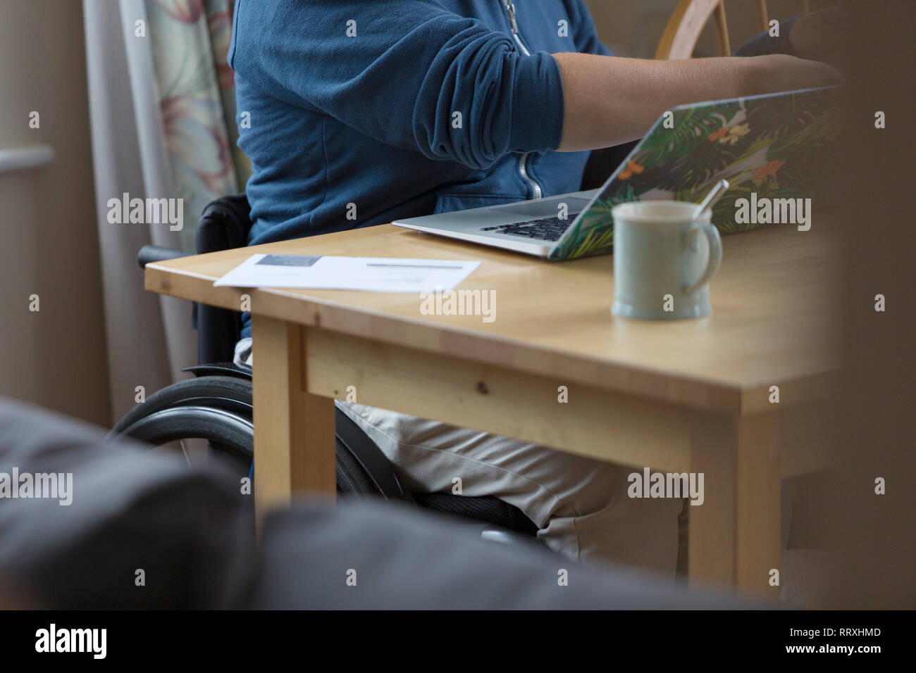 Young woman sitting dining table hi-res stock photography and images ...