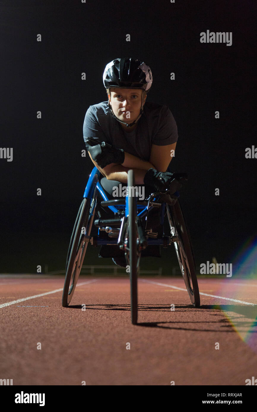 Portrait determined, tough young female paraplegic athlete training for ...