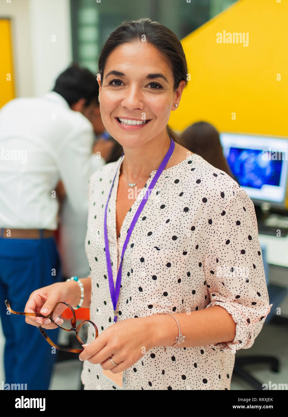 Portrait smiling, confident female teacher Stock Photo - Alamy Portrait smiling, confident female teacher Stock Photo - Alamy