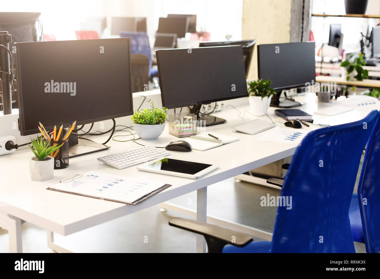 Modern coworking open space interior with computers Stock Photo - Alamy