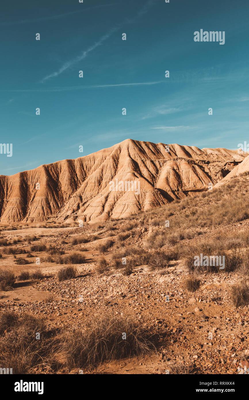 Desert cliffs under blue sky in landscape Stock Photo - Alamy