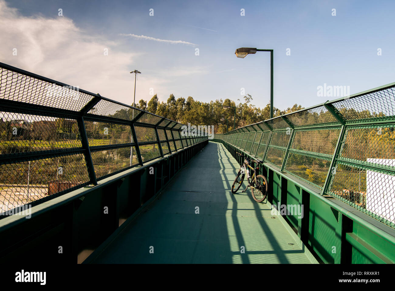 Mountain Bike on steel green Bridge Stock Photo - Alamy
