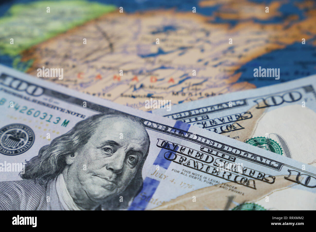 US dollars on the map of Canada. American investment and trading with ...