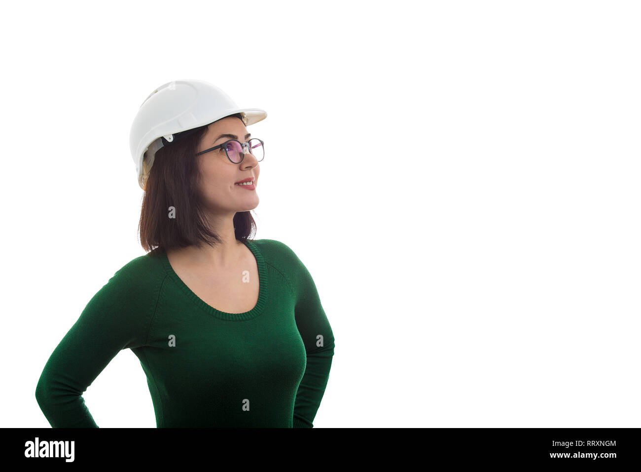 Confident young woman engineer wearing eyeglasses and protection helmet ...