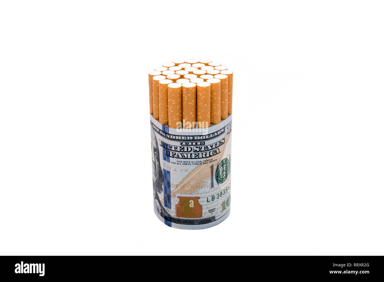 Smoking and money cost. Cigarettes wrapped in hundred dollars banknotes ...