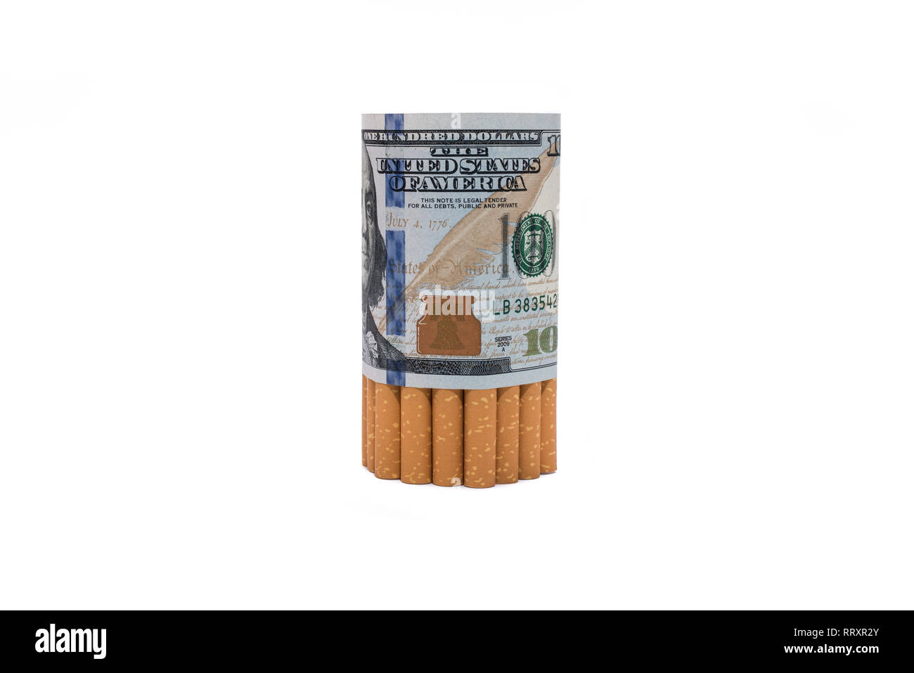 Smoking and money cost. Cigarettes wrapped in hundred dollars banknotes ...