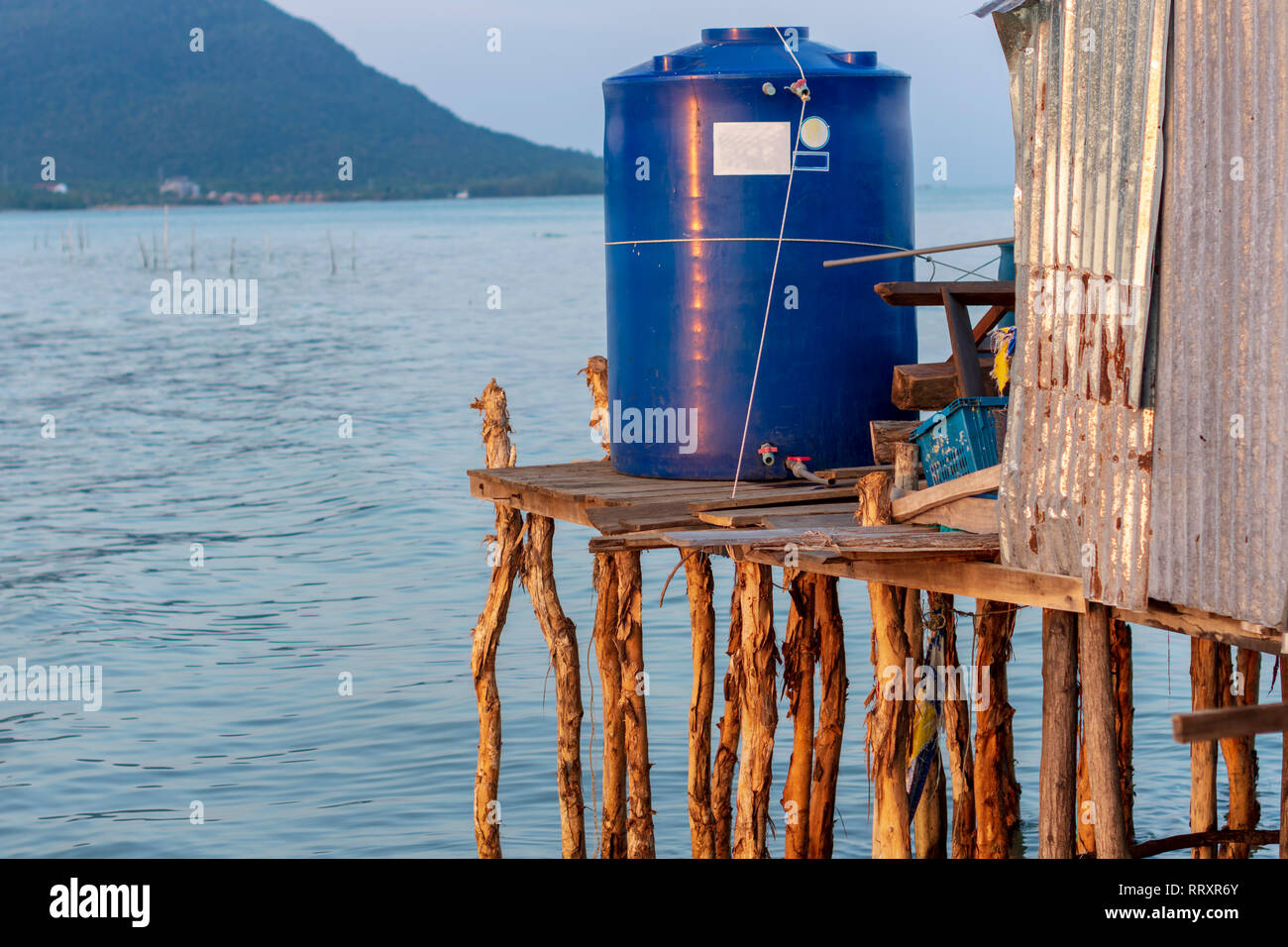 Plastic freshwater container outside a restaurant on piles out in the ...