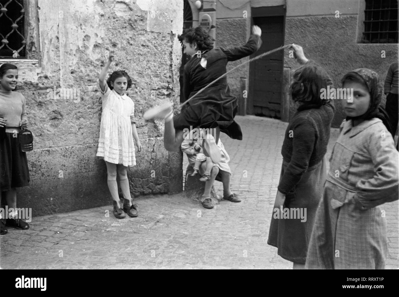 Children jump roping hi-res stock photography and images - Alamy
