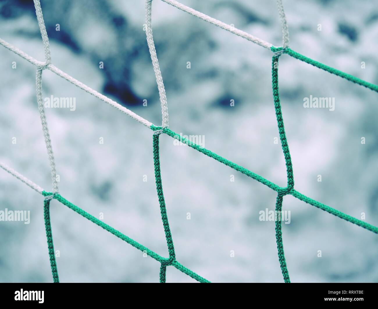 Empty football playground in winter. Soccer football net and blurry ...