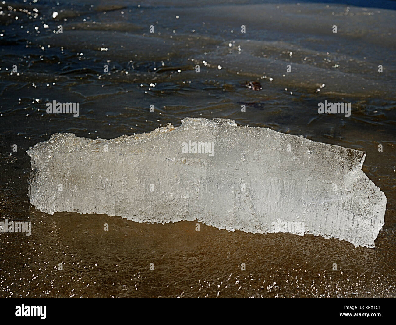 Ice board with cracks and bubbles. Natural flat ice piece Stock Photo ...