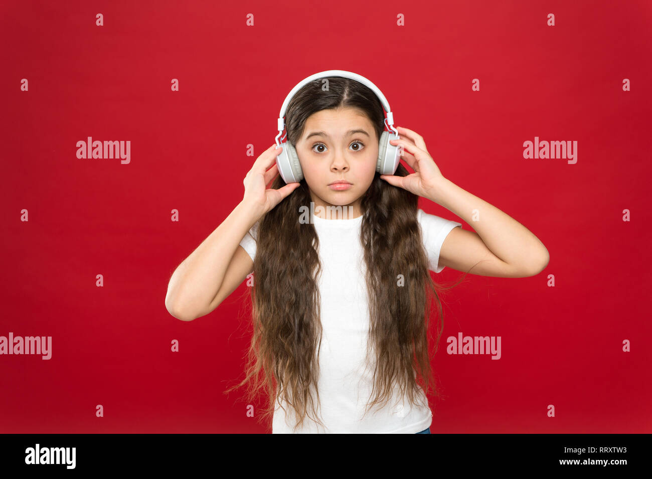 What is all this about. Small girl wearing stereo headphones. Cute ...