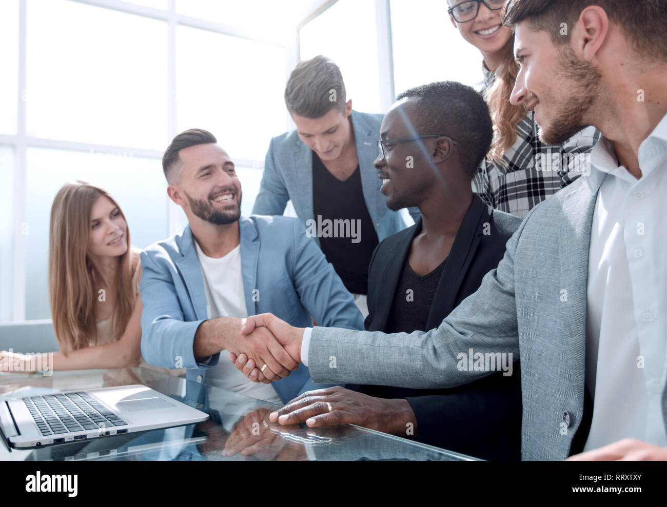 Happy for you. Group of joyful people working at office Stock Photo - Alamy