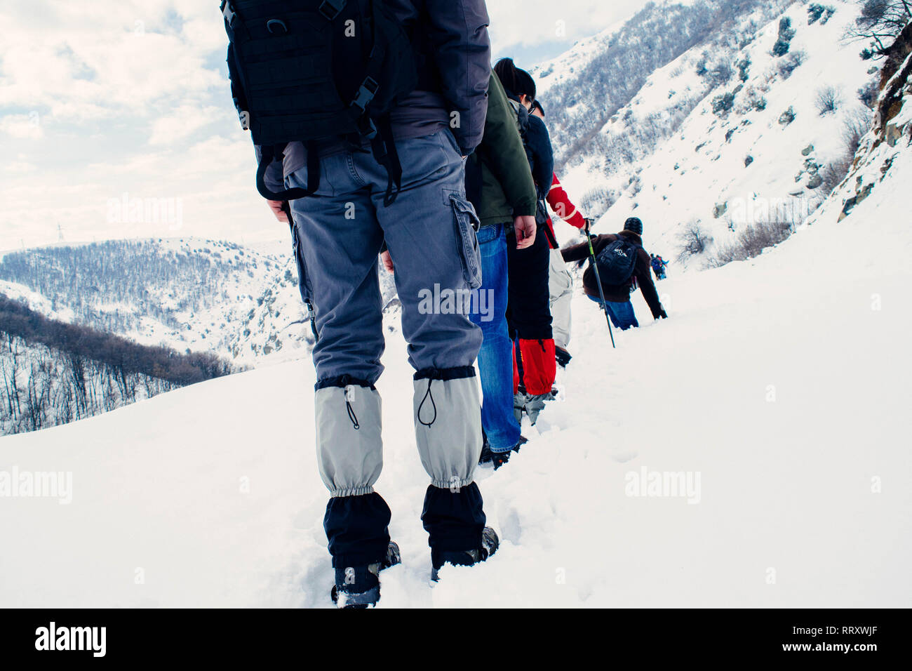 Hikers on a slippery mountain Stock Photo - Alamy