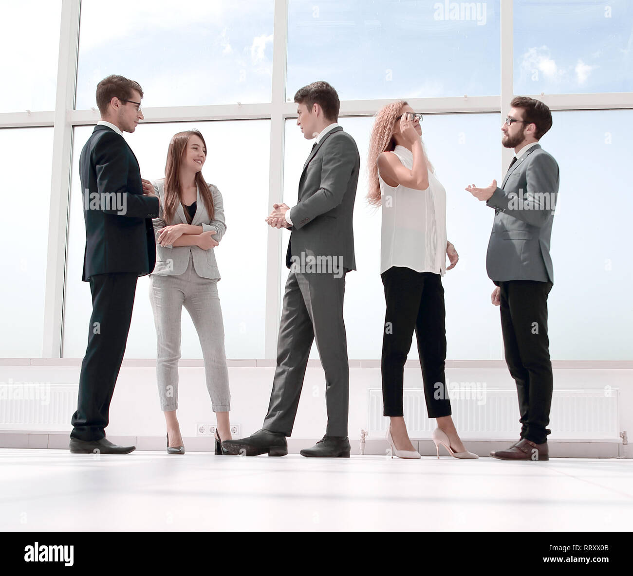 group of business people standing in a spacious hall Stock Photo - Alamy