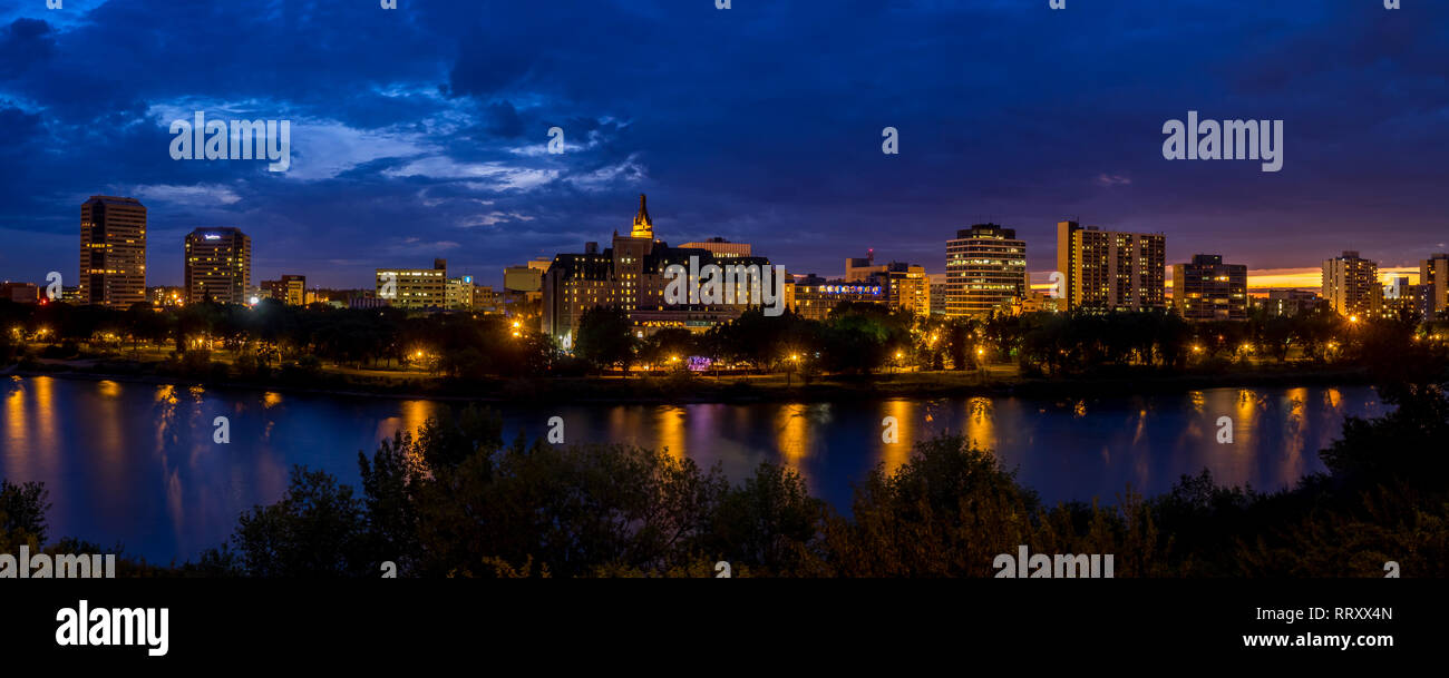 Saskatoon skyline at night along the Saskatchewan River and valley ...