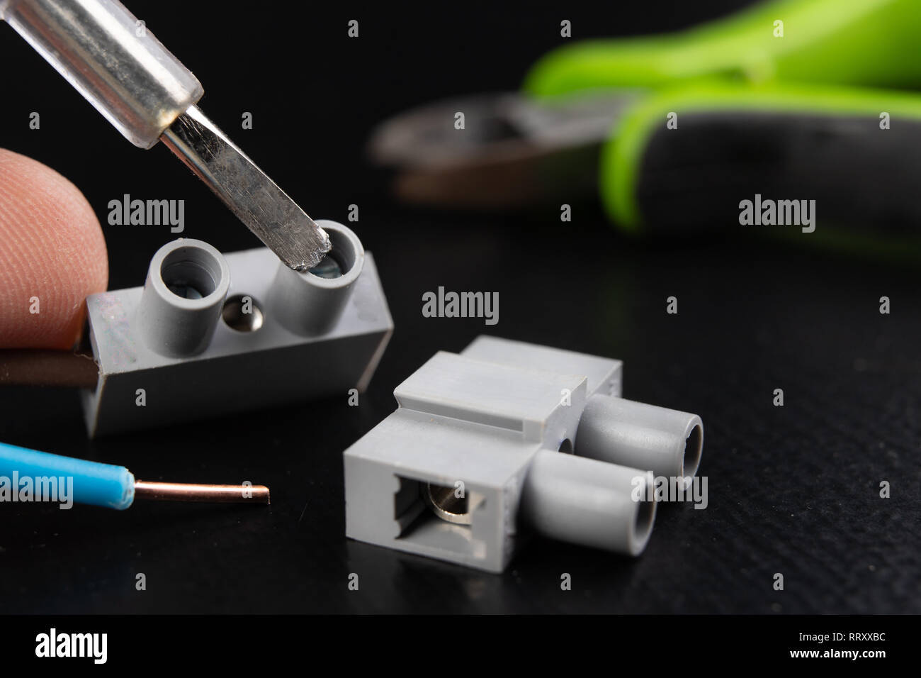 Electrical wires mounted to an electrical outlet. Electrical ...