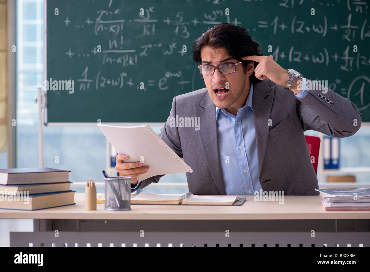 Professor and student discussing paper hi-res stock photography and ...