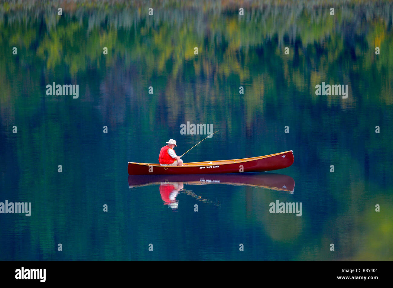 Senior male fishing from canoe hi-res stock photography and images - Alamy
