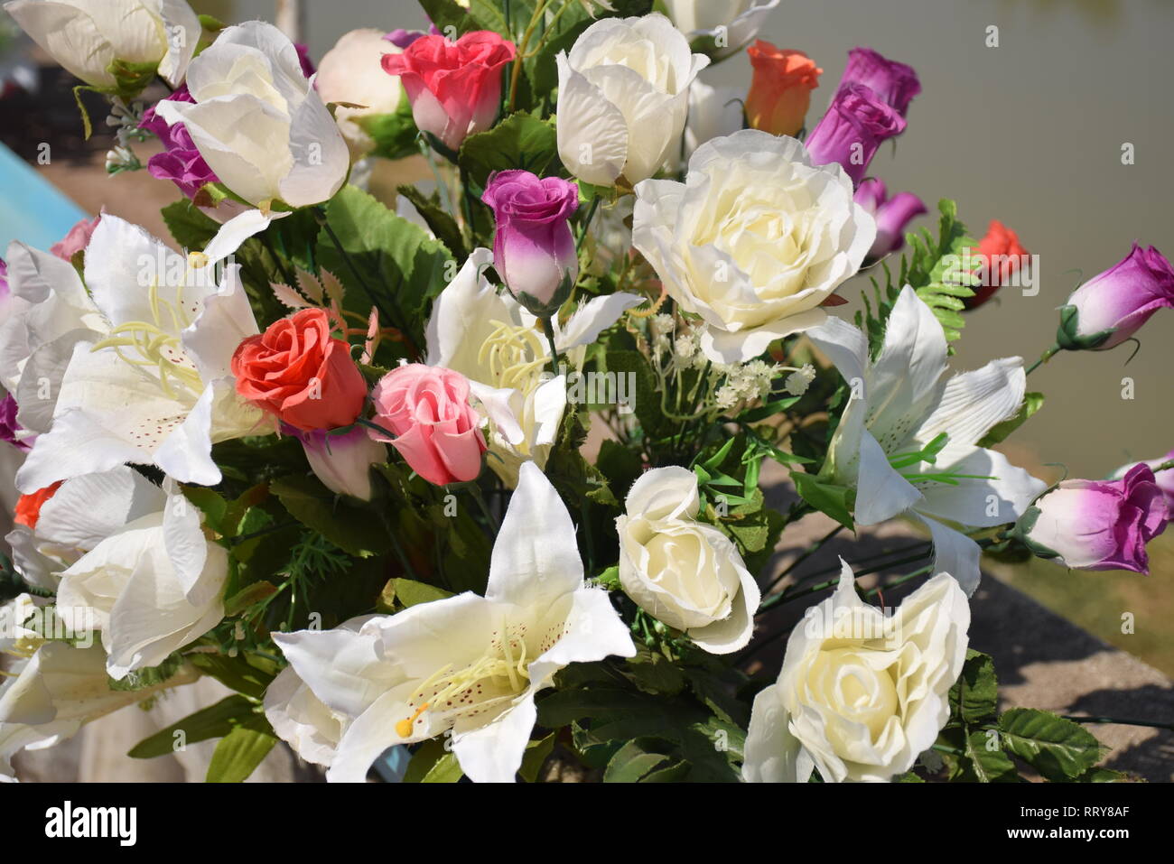 Colorful flower bouquet on the bridge to Kyauk Ka Lat pagoda on the ...