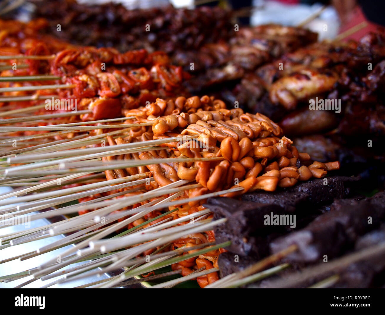 Close up photo of assorted chicken and pork innards barbecue sold at ...