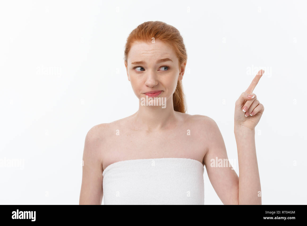 Portrait of caucasian cute in concern and shock, pointing index finger ...