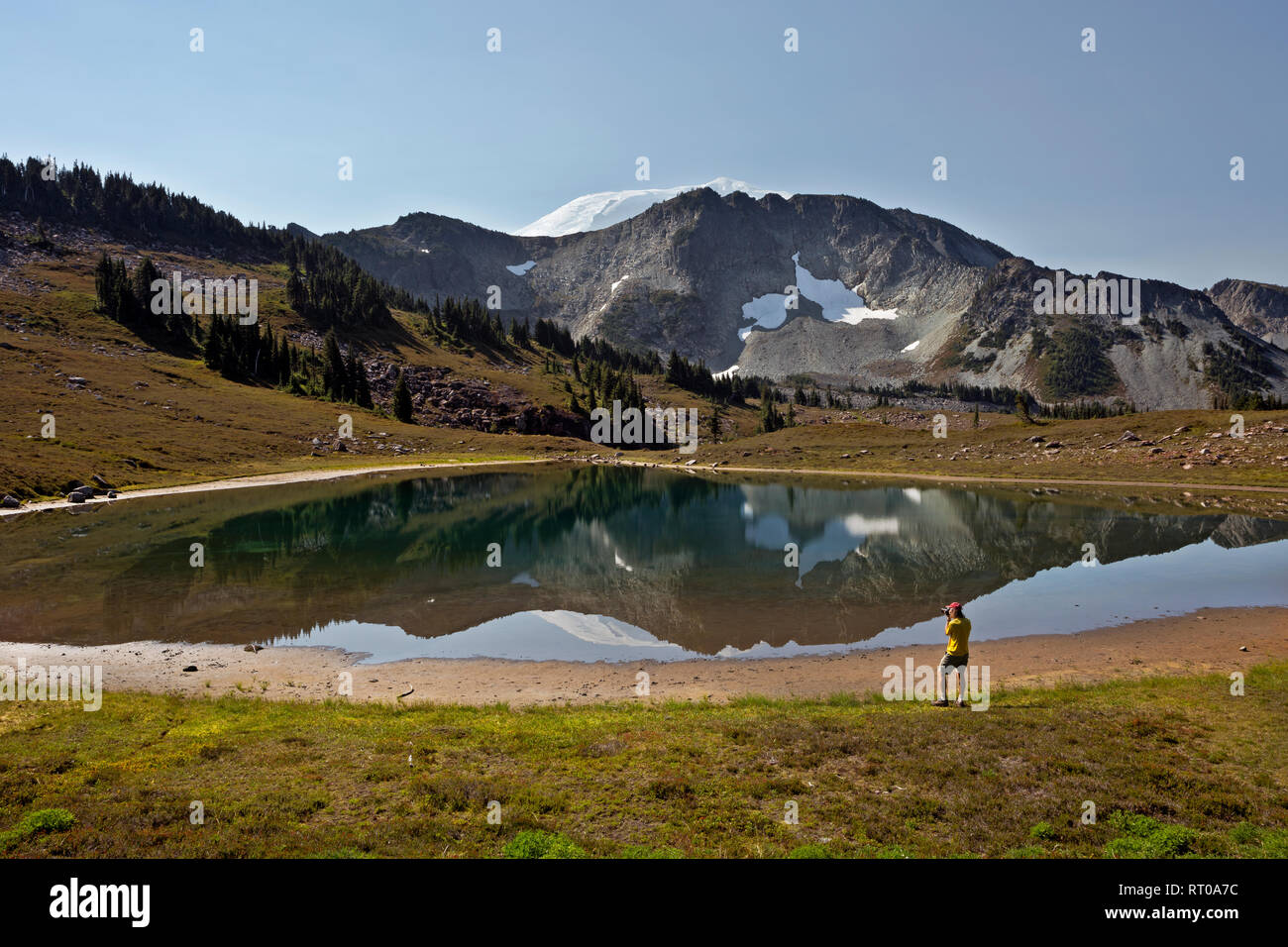 WASHINGTON - Mount Rainier and Crescent Mountain reflected in a small ...