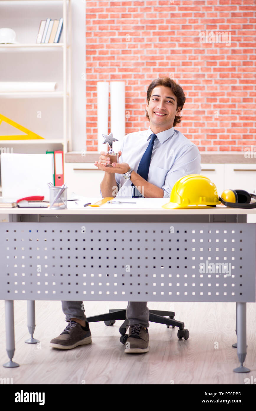 Construction supervisor working on blueprints Stock Photo - Alamy