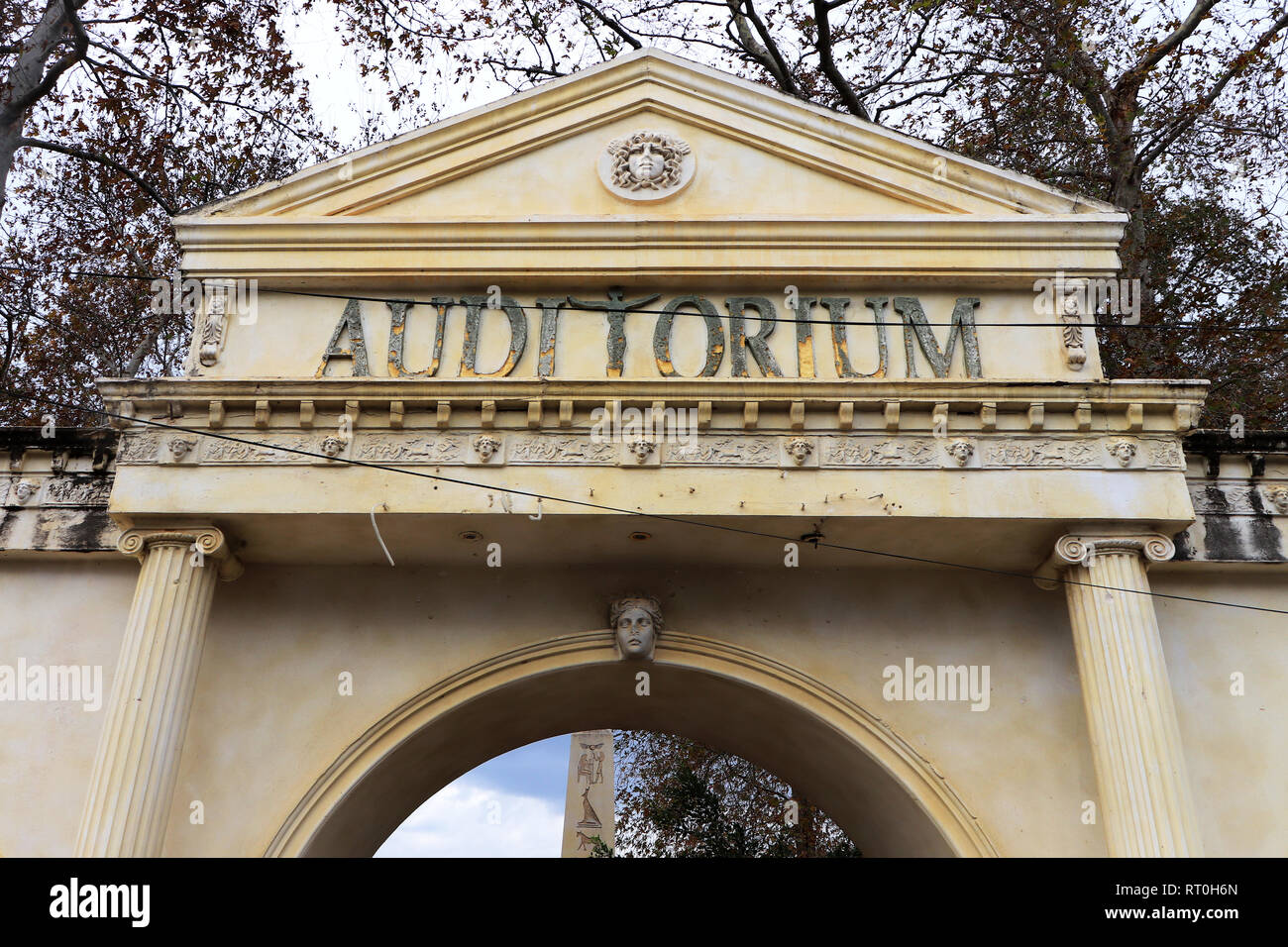 Main park entrance with inscription "Auditorium" and woman face on the ...