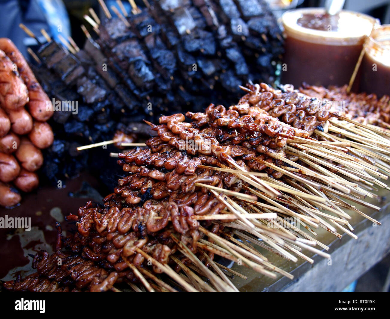 Close up photo of assorted chicken and pork innards barbecue sold at ...