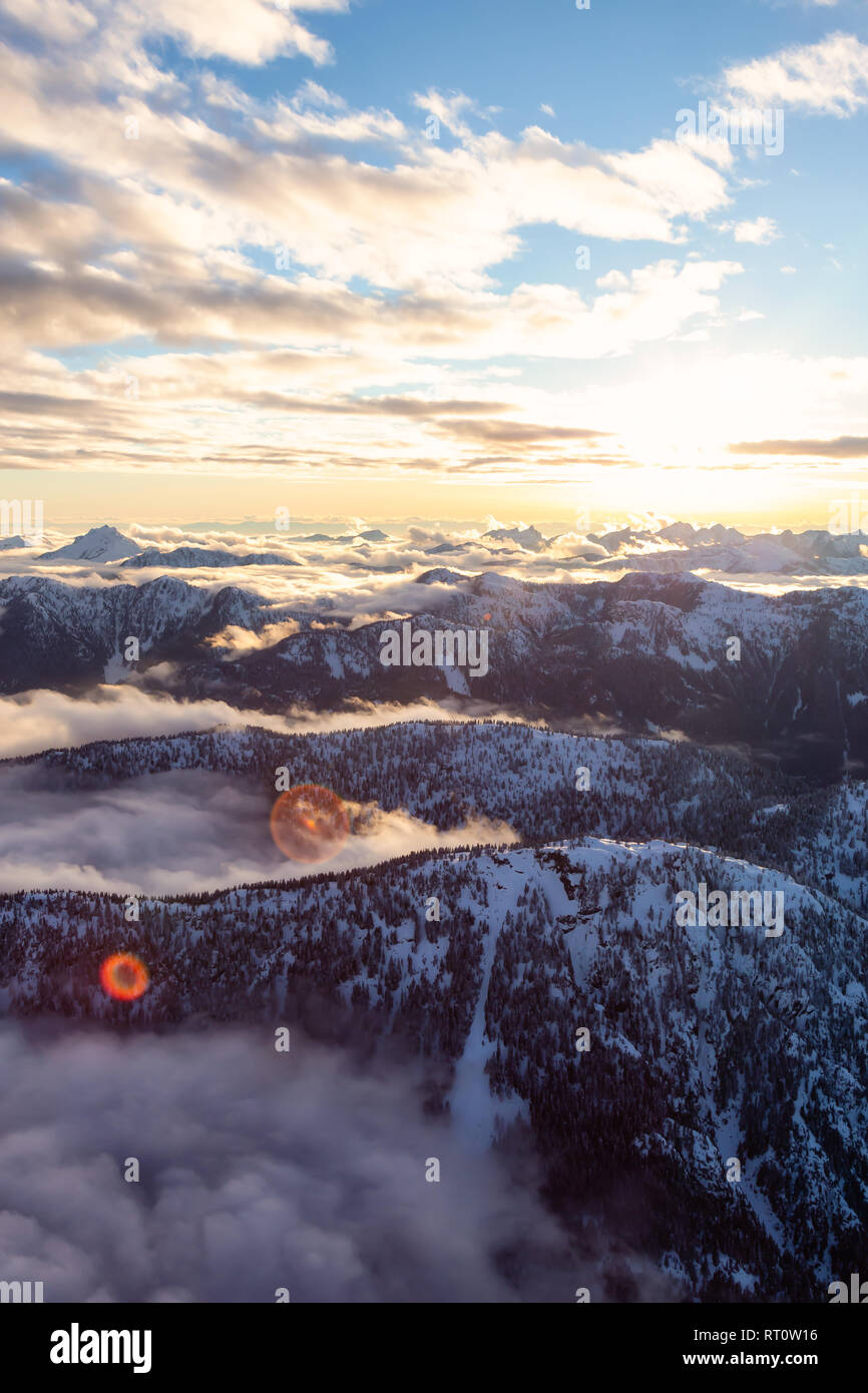 Aerial view of a beautiful Canadian Landscape during a winter sunset ...