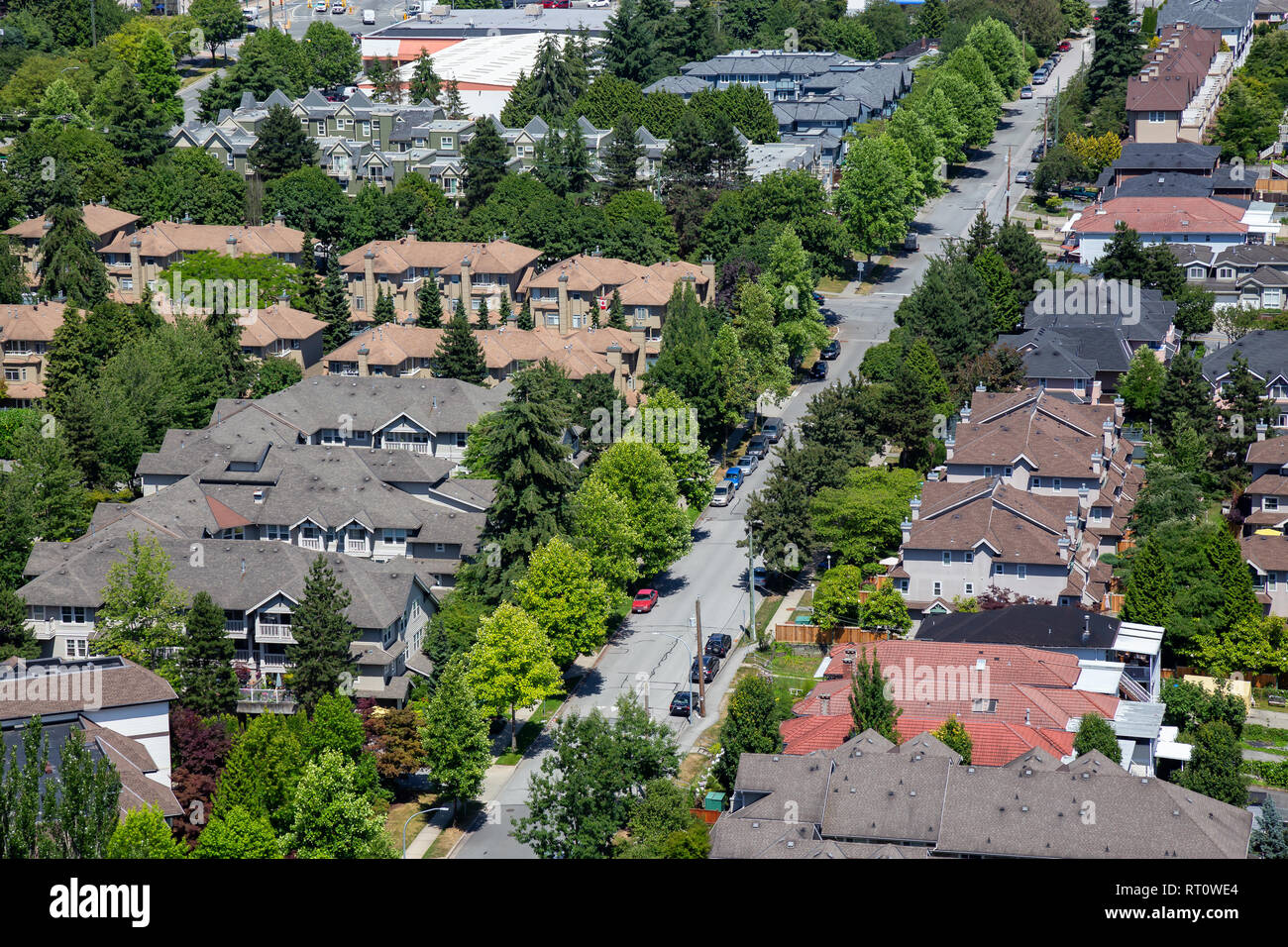 Aerial view of a residential homes in the suburbs during a sunny summer ...