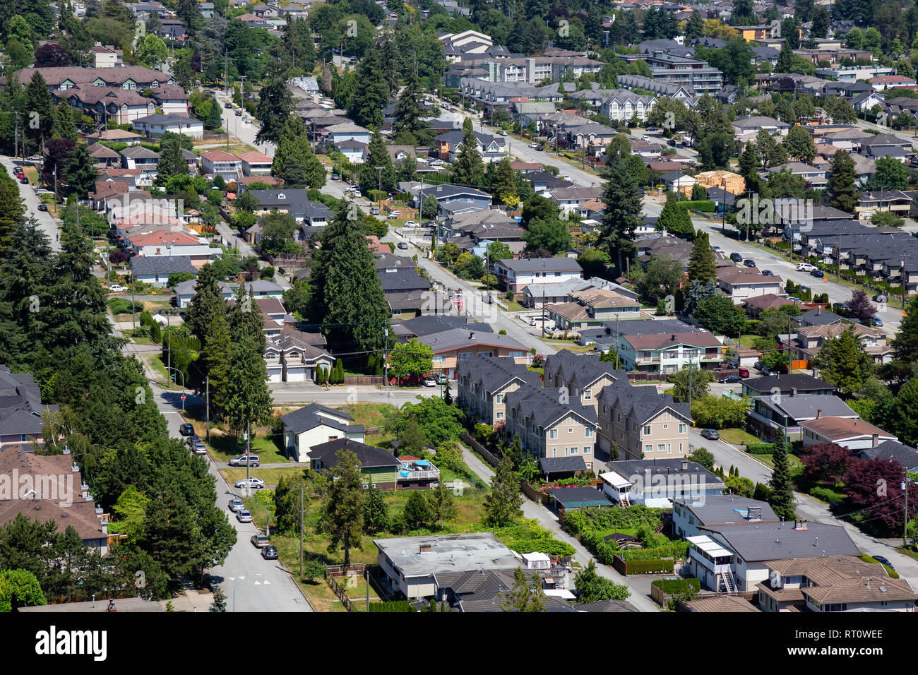 Aerial view of a residential homes in the suburbs during a sunny summer ...