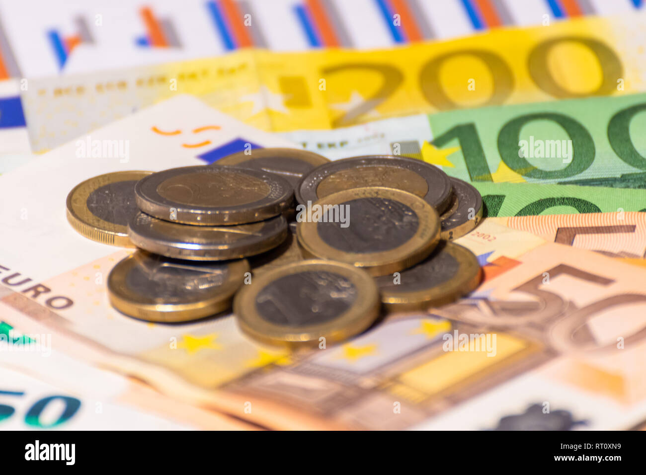 Financial report, coins and euro notes. Bills and money. Many Euro ...