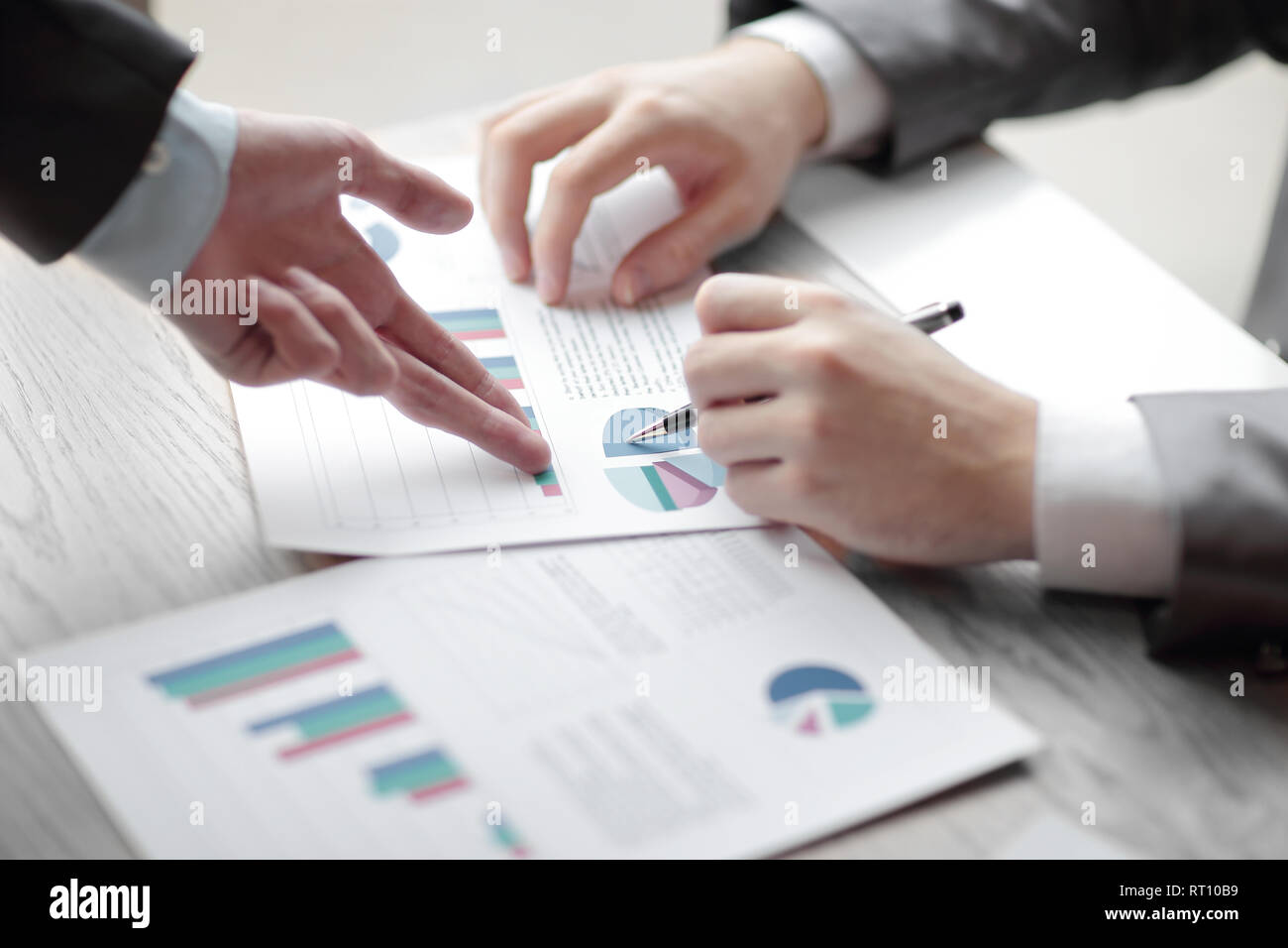 business man and Partner are proposing business plans to young ...