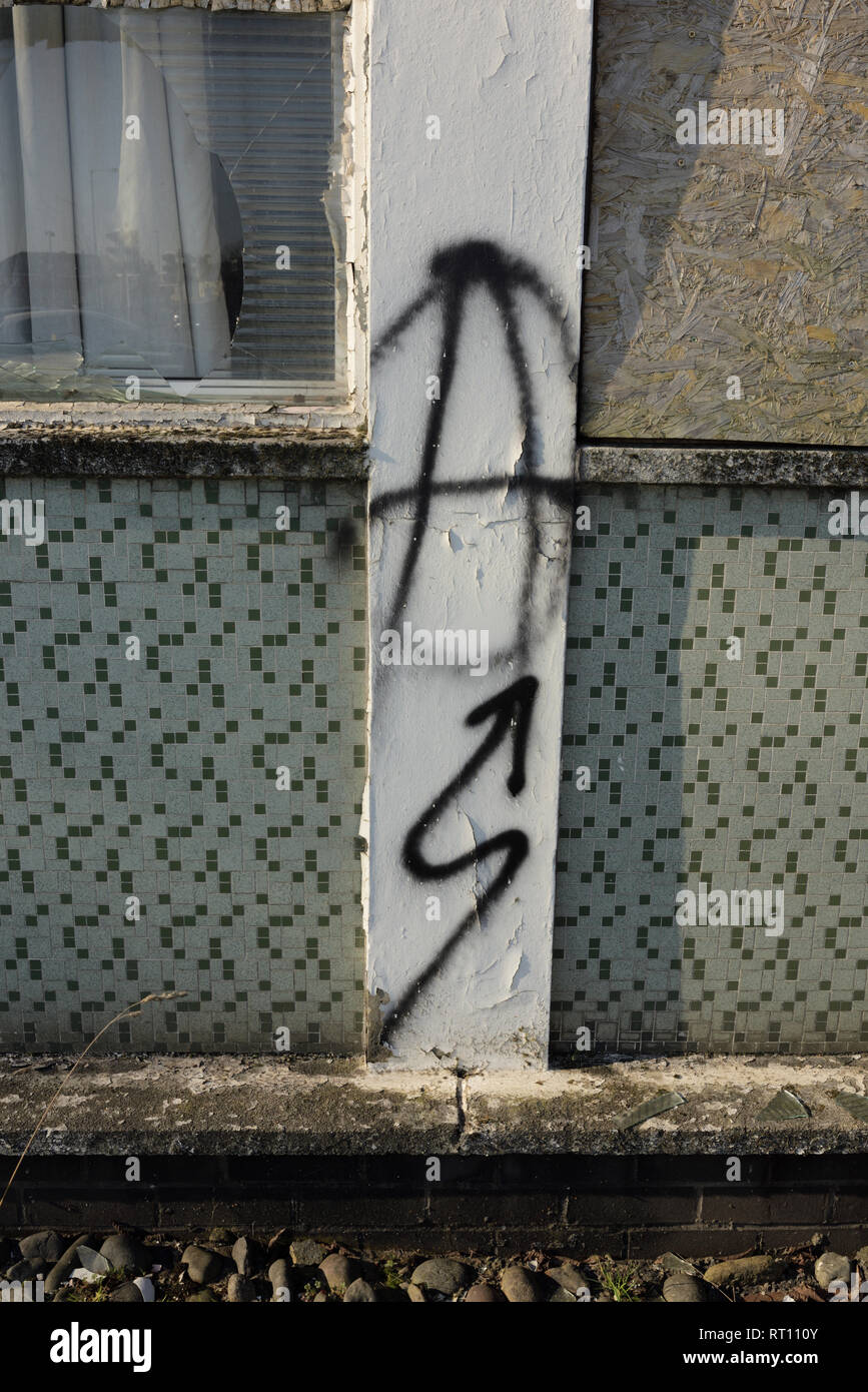 Broken windows and graffiti on Disused and derelict fire station in ...