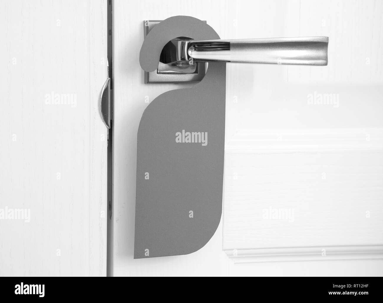 Hotel door handle with blank paper hanger Stock Photo - Alamy
