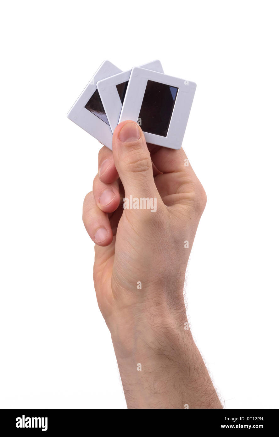 Holding a very old slide photo, isolated on white Stock Photo - Alamy