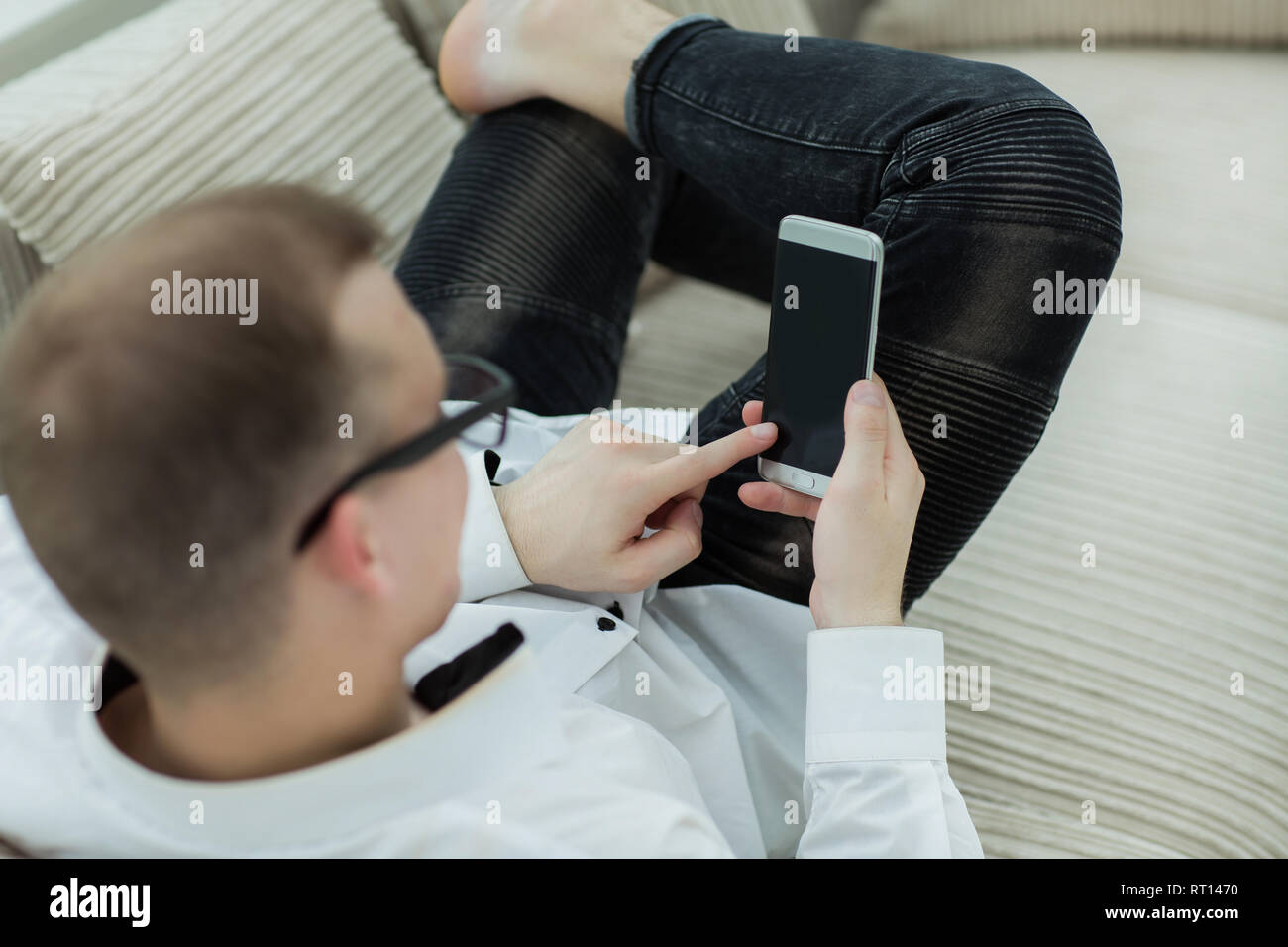 modern man looking through a text on his smartphone Stock Photo - Alamy