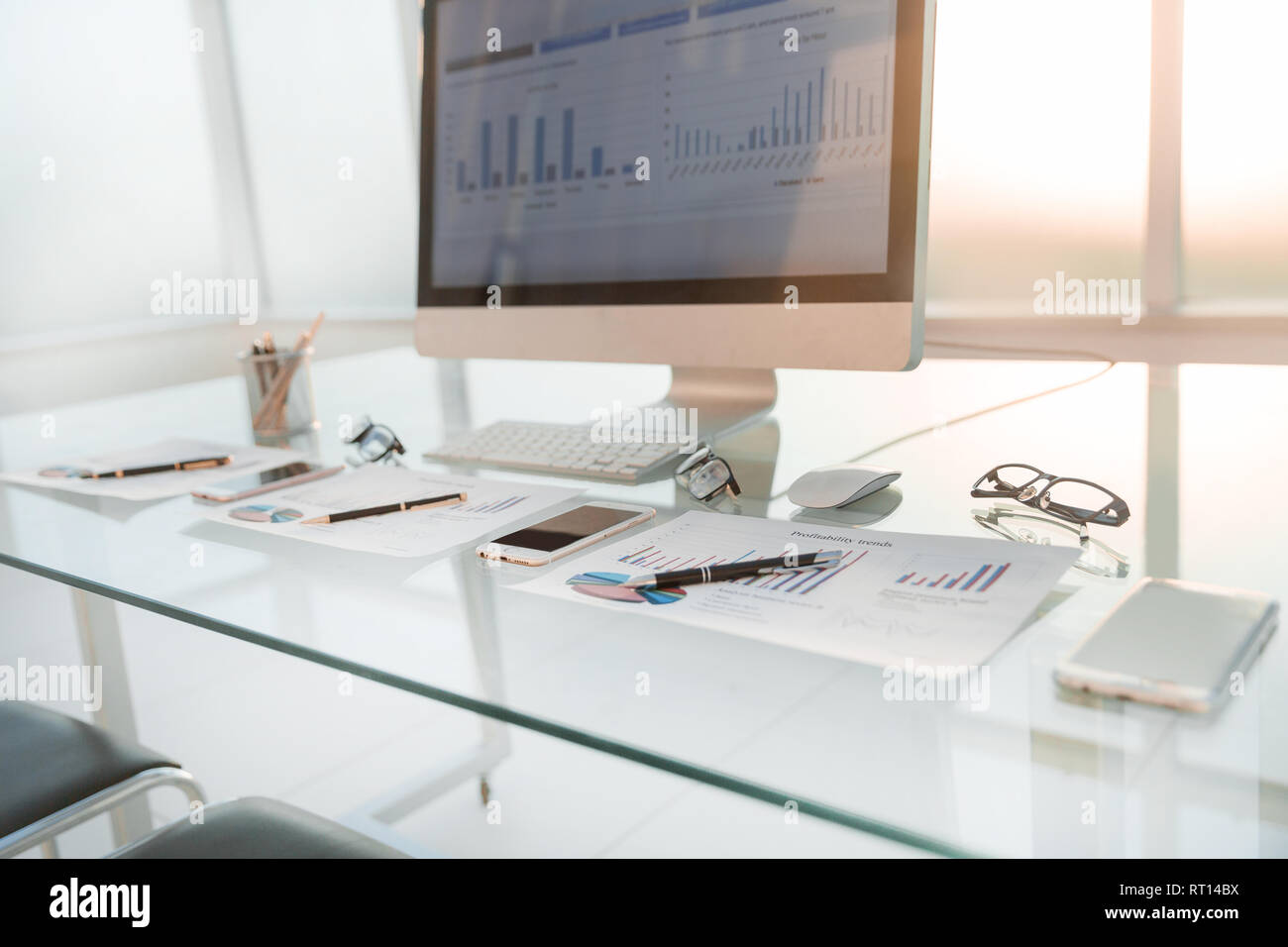 financial charts on the Desk in the office Stock Photo - Alamy