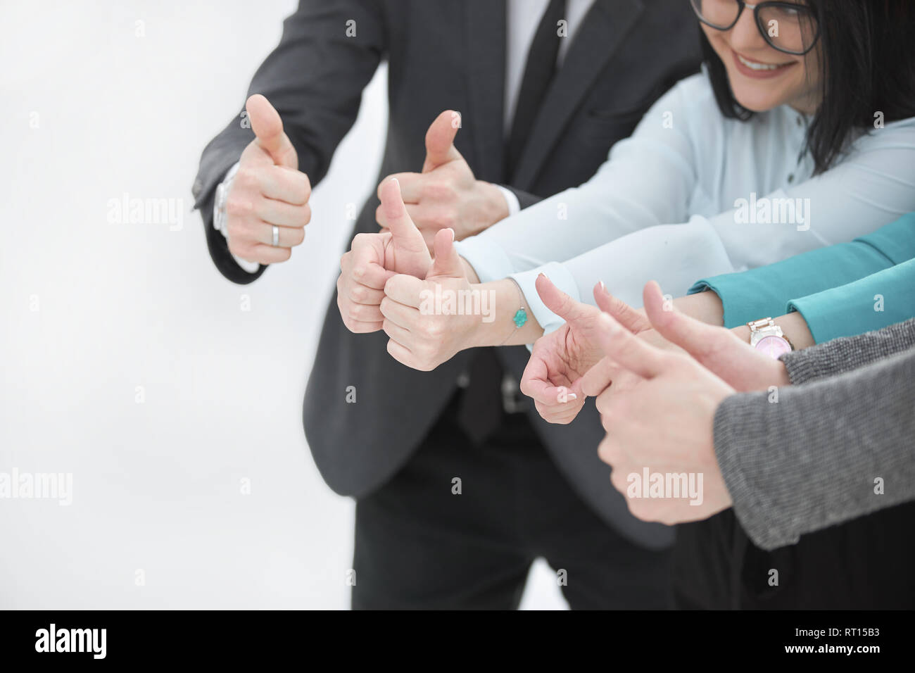 professional employees of the company showing thumbs up Stock Photo - Alamy