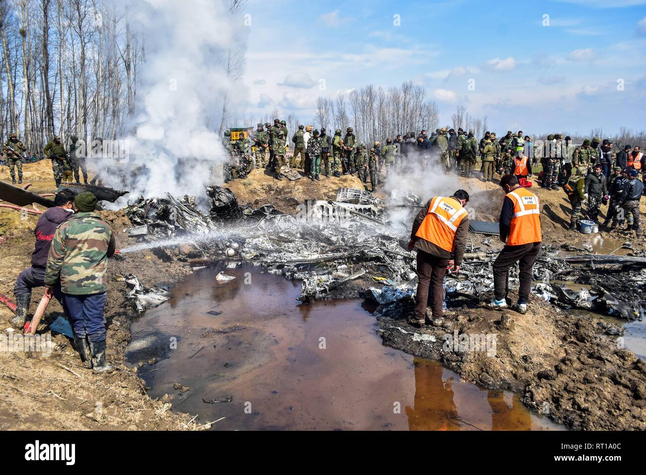 Firefighters spray water wreckage hi-res stock photography and images ...