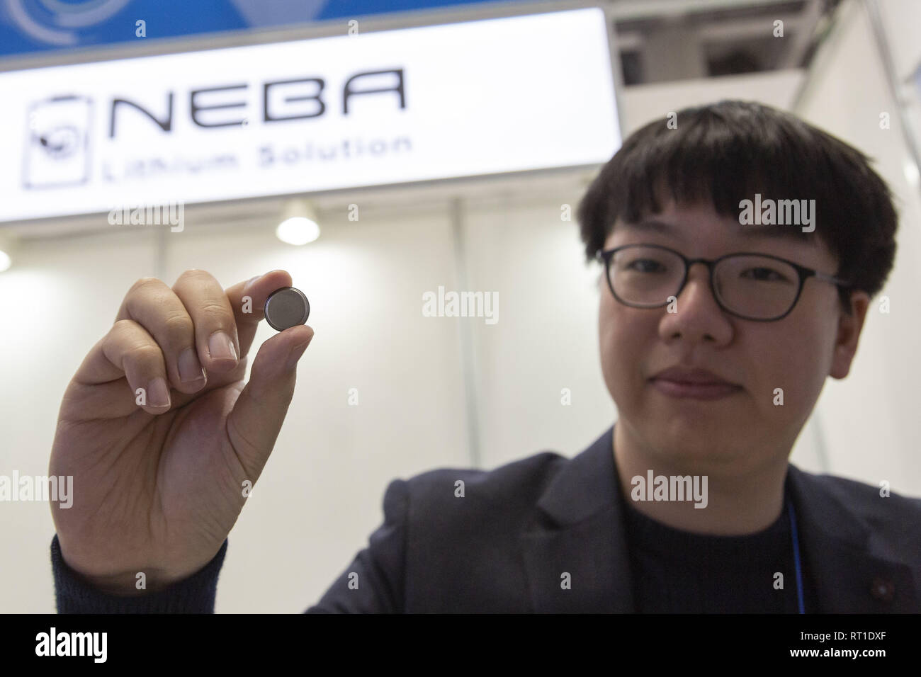 Tokyo, Japan. 27th Feb, 2019. An exhibitor shows a Lithium coin battery ...