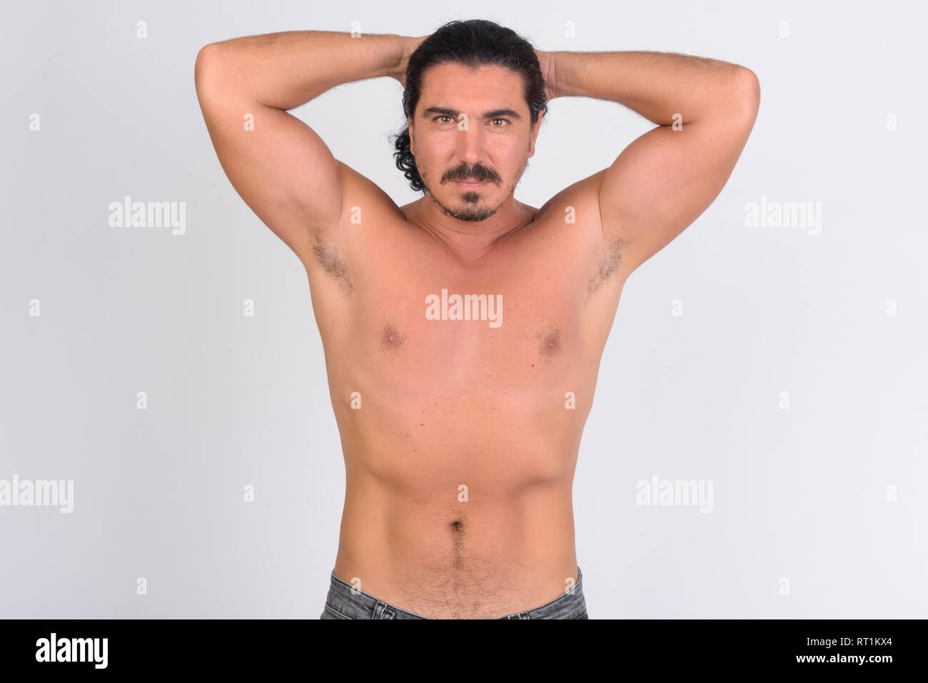 Shirtless handsome macho man with mustache flexing Stock Photo - Alamy