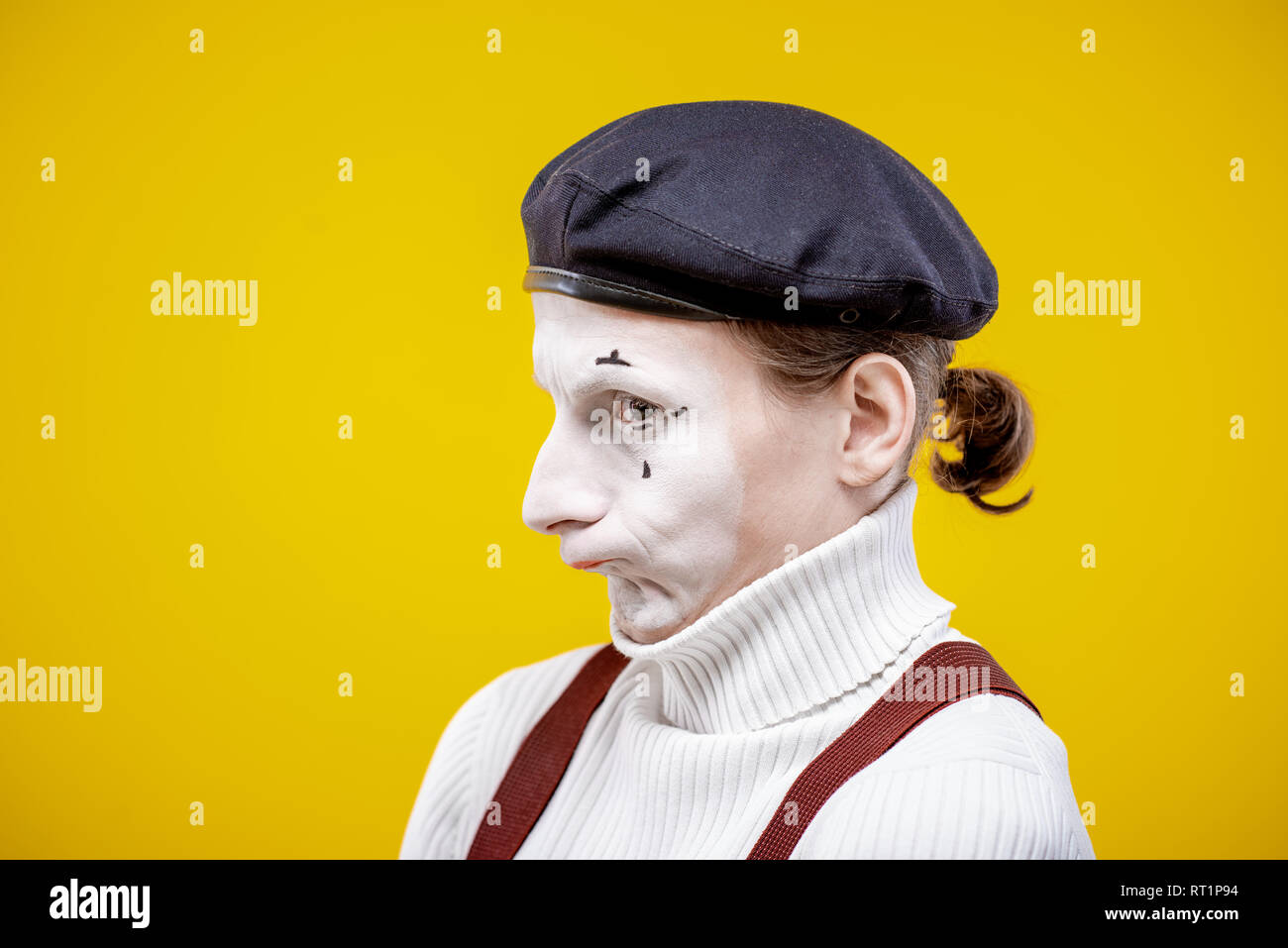 Portrait of an actor as a pantomime with white facial makeup showing ...