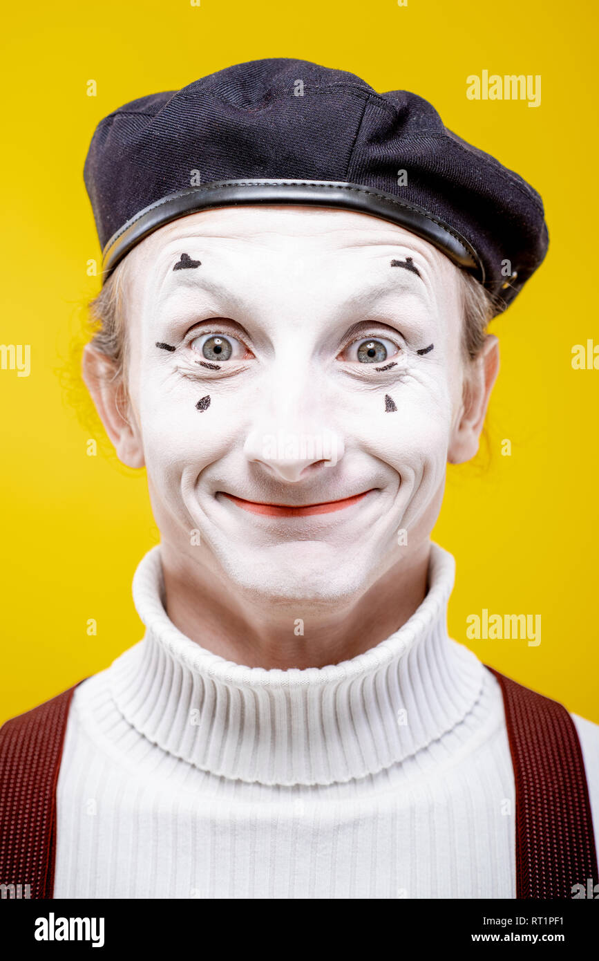 Close-up portrait of an actor as a pantomime with white facial makeup ...