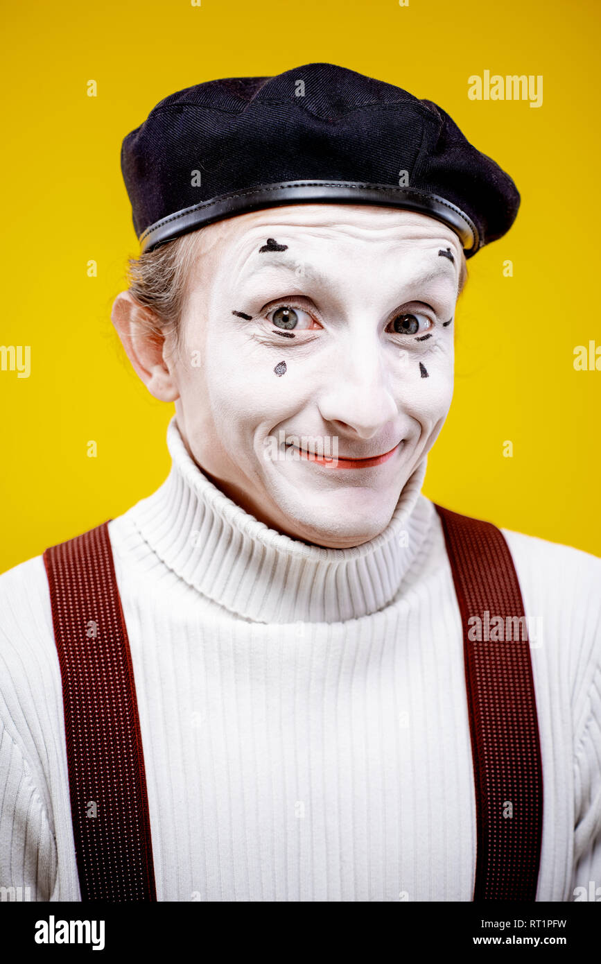 Close-up portrait of an actor as a pantomime with white facial makeup ...