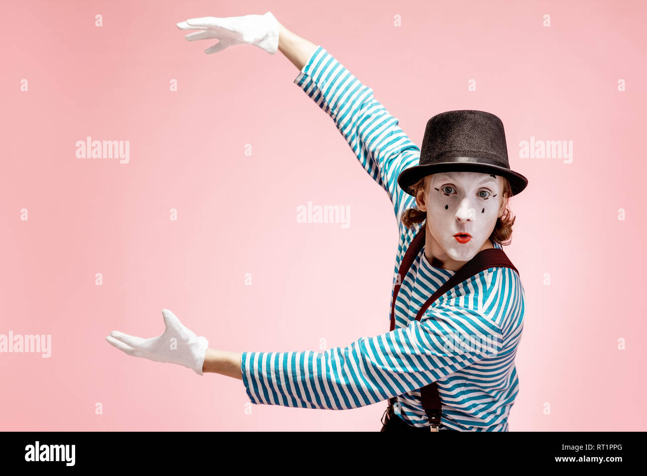 Emotional pantomime with white facial makeup showing empty space of the ...