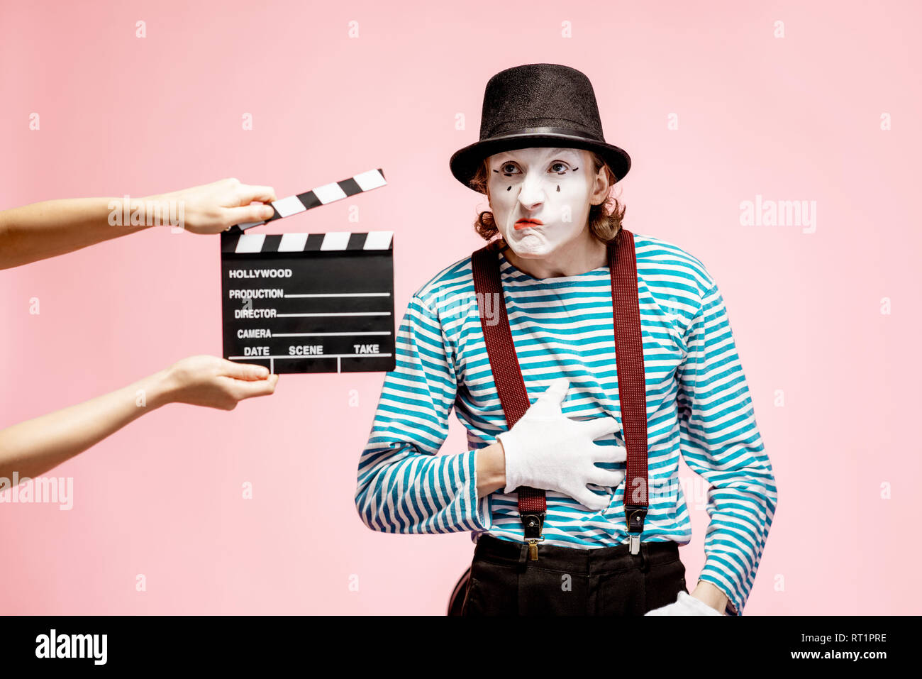 Portrait of an actor as a pantomime with cinematography clapperboard on ...