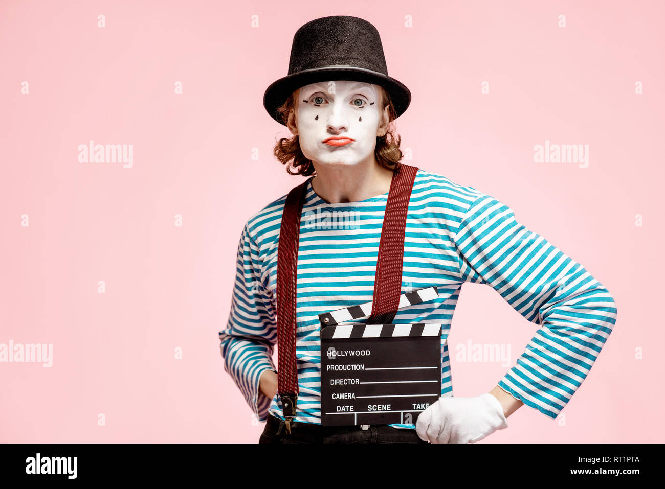 Portrait of an actor as a pantomime with cinematography clapperboard on ...